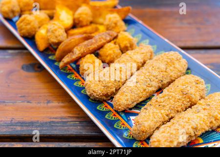 Fry fish finger and potato wedges Stock Photo - Alamy