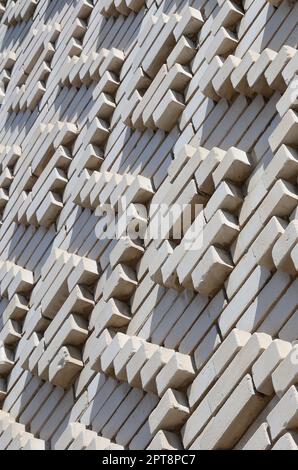 A pattern made of white bricks in the form of diamond shapes ...