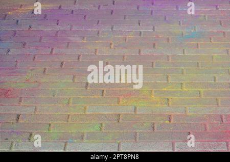 Multi colored earth, paving slabs, powder coated with dry colors at the ...
