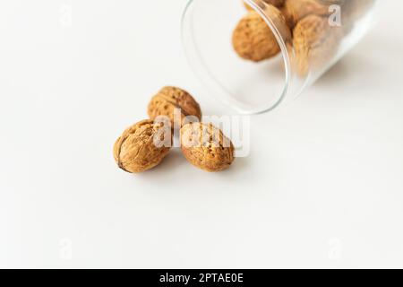 Beautiful whole walnut kernels in a glass jar, whole nuts in the shell ...