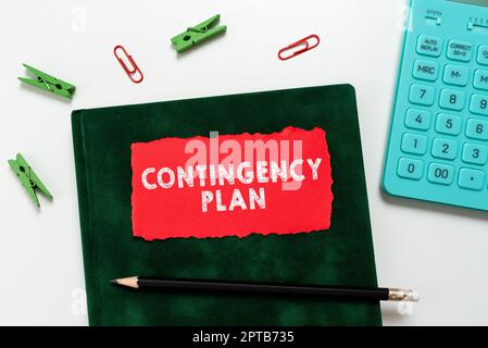 Sign displaying Contingency Plan, Internet Concept appears in response ...