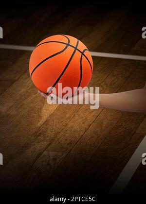 basketball ball in man's hand. basketball game concept Stock Photo - Alamy