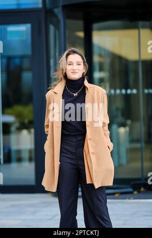 Young woman thinking about future and makes investment in her future ...