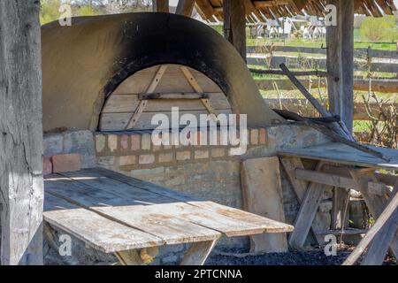 Medieval hut with baking oven in sunny ambiance Stock Photo - Alamy