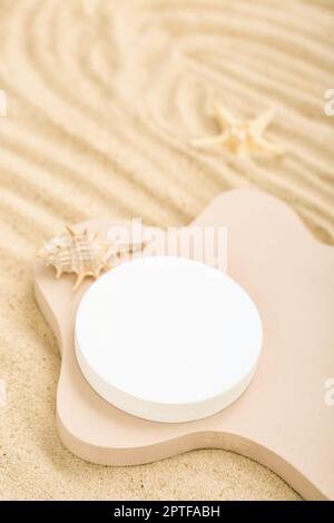 Decorative plaster podiums, starfish and seashell in sand Stock Photo ...