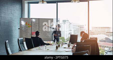 Getting the team onboard with her plan. an executive giving a ...