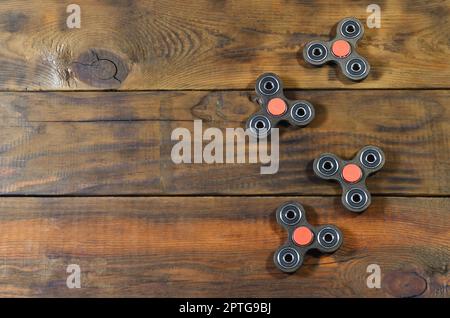 Popular finger spinner device. Modern fidget spinning toy on bearings ...