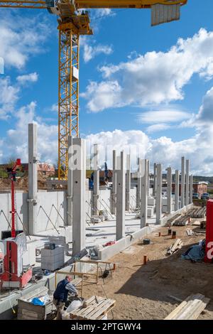 many concrete pillars for a factory building are erected on a ...