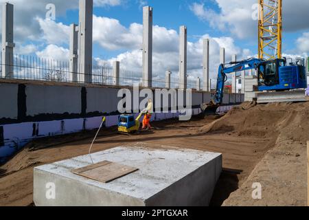 many concrete pillars for a factory building are erected on a ...