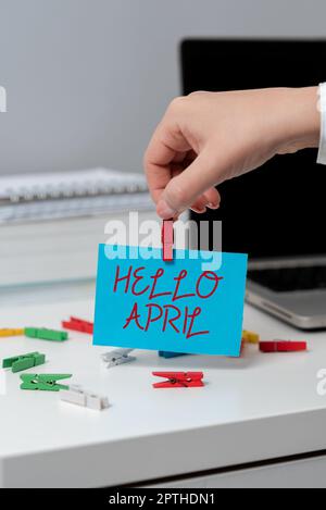 Hand writing sign Hello April, Word for a greeting expression used when ...