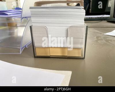 Small square pieces of paper for notes and notes on the office desk and ...