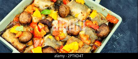 Roasted hake fish with orange, tomato and mushrooms Stock Photo - Alamy