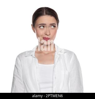 Embarrassed young woman in shirt on white background Stock Photo - Alamy