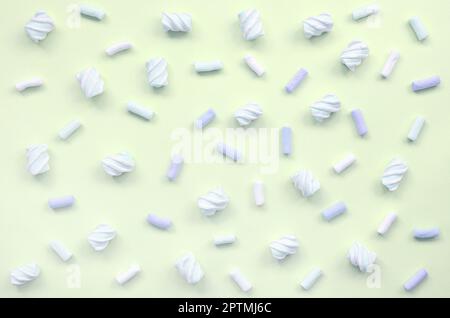 Colorful marshmallow laid out on lime paper background. pastel creative ...