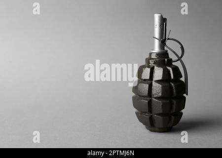 Hand grenade on grey background, closeup. Space for text Stock Photo ...