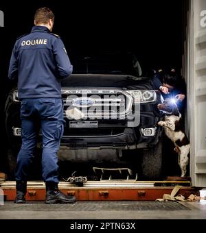 ROTTERDAM - A customs officer of the Port of Rotterdam Customs with a ...