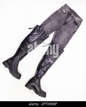flat lay of grey jeans and black boots Stock Photo - Alamy