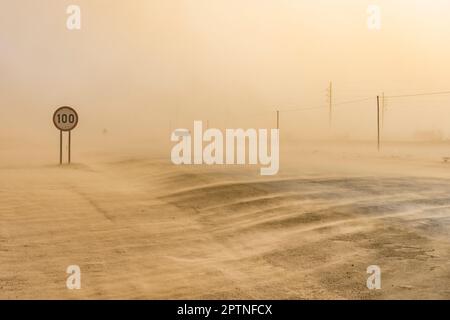 Sandstorm covering the road from Swakopmund to Walvis Bay in Namibia ...