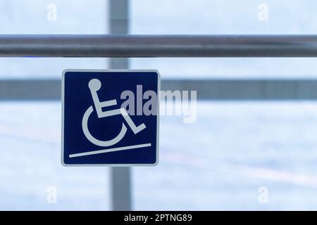 Disabled sign Tilted floor warning wheelchair care Stock Photo - Alamy
