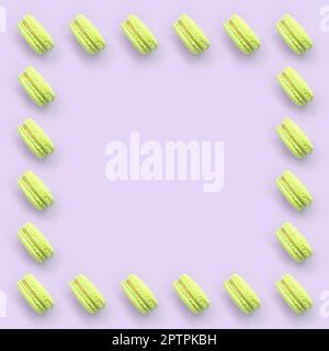 Lime dessert cake macaron or macaroon on trendy pastel lilac background ...