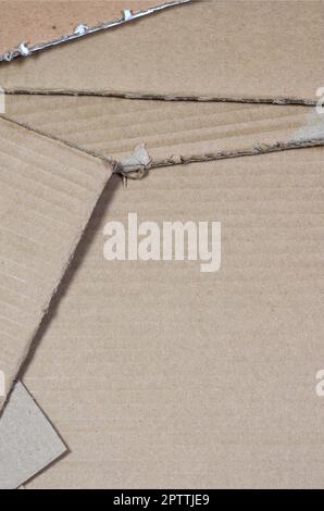 parcels boxes with kraft paper, on wooden table on grey background ...