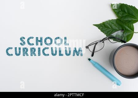 Sign displaying School Curriculum, Business overview designed to ...