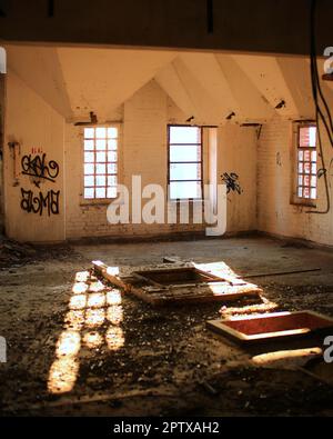 Abandoned silo interior with debris and bright sunlight Stock Photo - Alamy