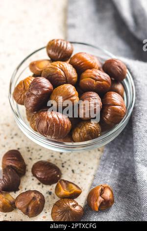 Peeled chestnuts. Sweet roasted chestnuts in scoop isolated on the ...