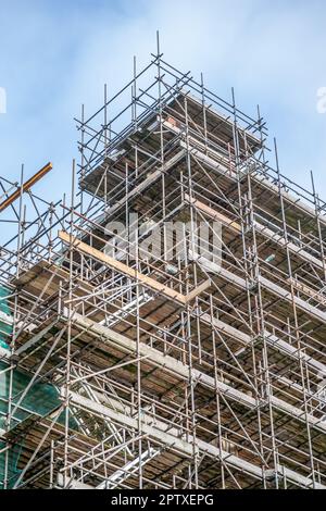 Build construction with steel scaffolding around raw structure Stock ...