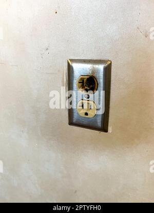 Electrical outlet with burn marks on wall from short circuit Stock ...