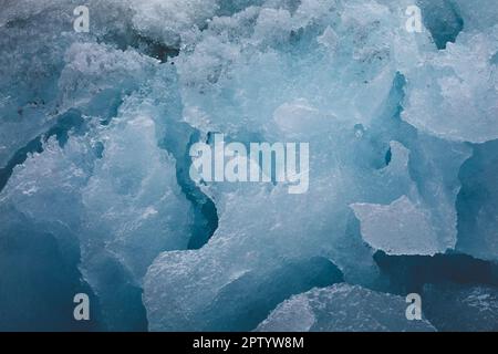 Ice blocks melting off an iceberg, icy shapes forming Stock Photo - Alamy