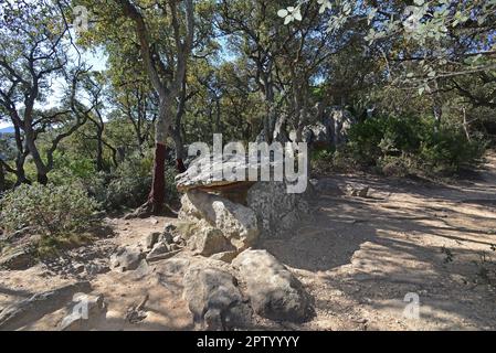 A prehistoric dolmen, made from four vertical wall slabs of stone and a ...