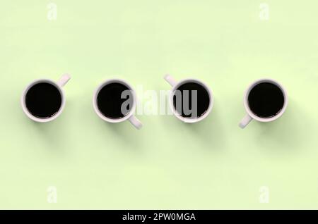 Many small white coffee cups on texture background of fashion pastel ... Many small white coffee cups on texture background of fashion pastel ...