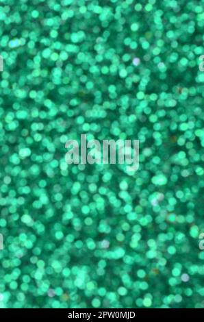 Blurred green decorative sequins. Background image with shiny bokeh ...