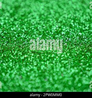 A huge amount of green decorative sequins. Background image with shiny ...