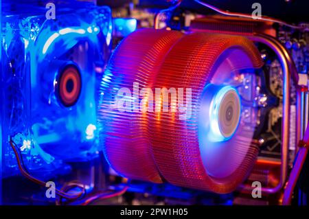 Colorful illuminated fans with cooling fins inside personal computer ...