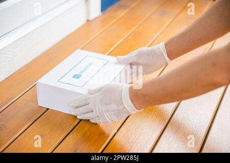 Buy online clinic retail Rx drug store, Delivery man holding medication ...