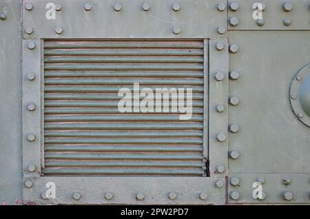 The texture of the wall of the tank, made of metal and reinforced with ...