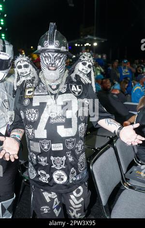 A Las Vegas Raiders fan poses before an NFL football game against the ...