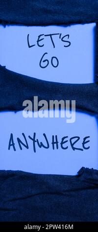 Hand writing sign Let's Go Anywhere. Concept meaning visit new places ...