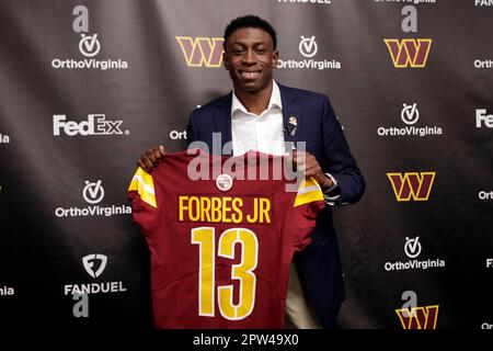 Washington Commanders cornerback Emmanuel Forbes Jr., (13) stretches ...