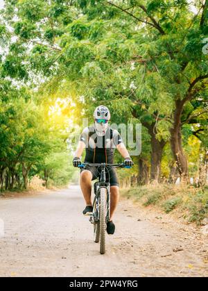 Lifestyle of a chubby cyclist on the road. Professional cyclist on a ...