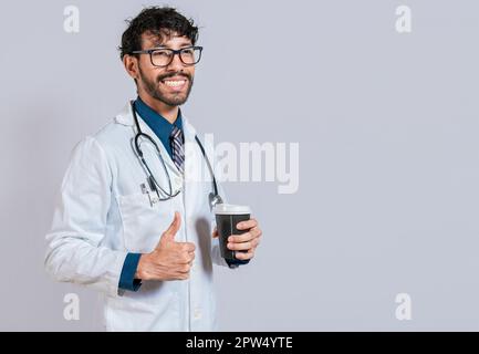 smiling doctor with a takeaway coffee. isolated on a white Stock Photo ...