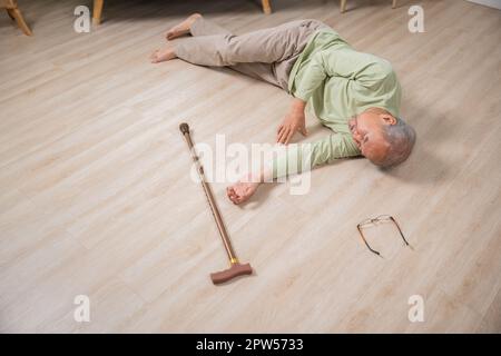 Sick senior old man falling down lying on the ground because stumbled ...