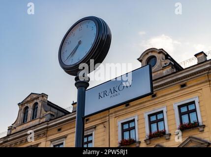 A picture of the Krakow clock on the Holy Spirit Square Stock Photo - Alamy