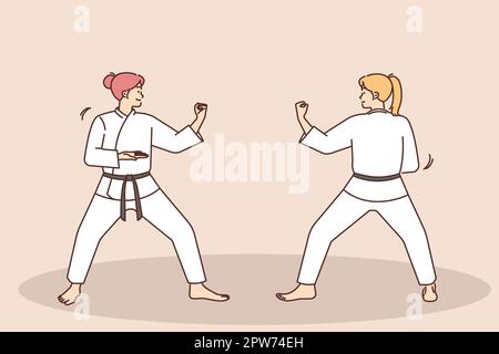Women in white uniform practice judo fighting. Females engaged in ...