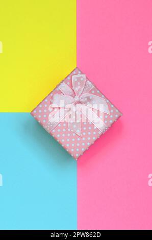 Small pink gift box lie on texture background of fashion pastel ...