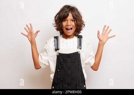 Photo of young excited overjoyed curly hair woman wear stylish striped ...