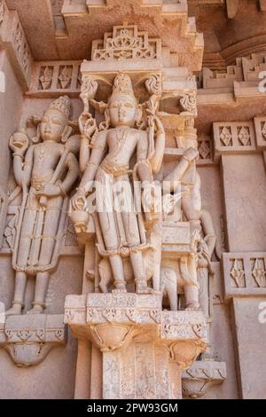 hindu god unique idol engraved art on temple wall from flat angle at ...
