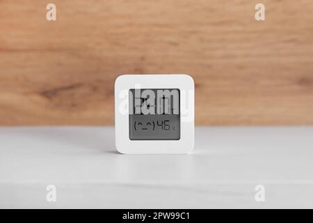 Digital hygrometer with thermometer on table in children's room ...